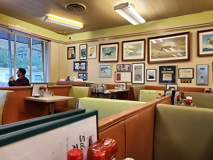 Horse racing prints and decades of framed memories line the walls. Not curated nostalgia—just the natural accumulation of a place that matters.