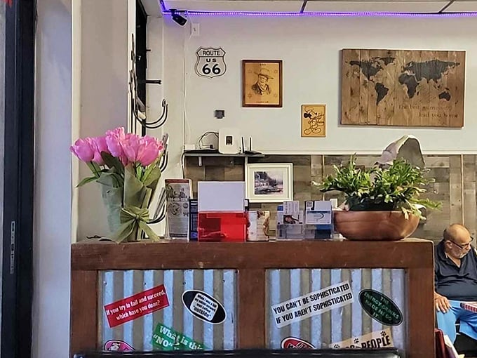 Fresh flowers and homey touches at the counter prove JoJo's isn't just serving food—they're creating an experience that keeps locals coming back for "just one more coffee."