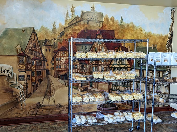 A European village mural watches over racks of bread – because even painted townspeople can't resist the aroma of fresh-baked goodness.