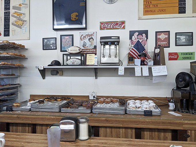 The wall of fame showcases decades of donut dedication. Each framed memory tells a story of Santa Clara's sweetest tradition.