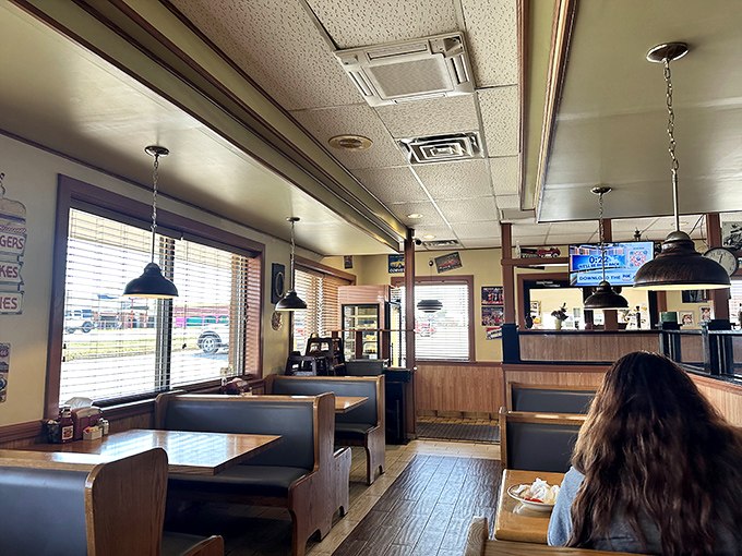 The classic diner layout—where every booth feels like the best seat in the house. These blue seats have cradled generations of satisfied customers.