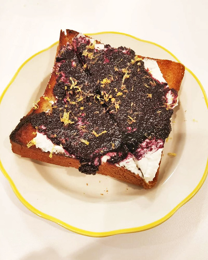 Toast elevated to art form—thick-cut bread becomes the canvas for a vibrant jam creation that transforms breakfast into a celebration.
