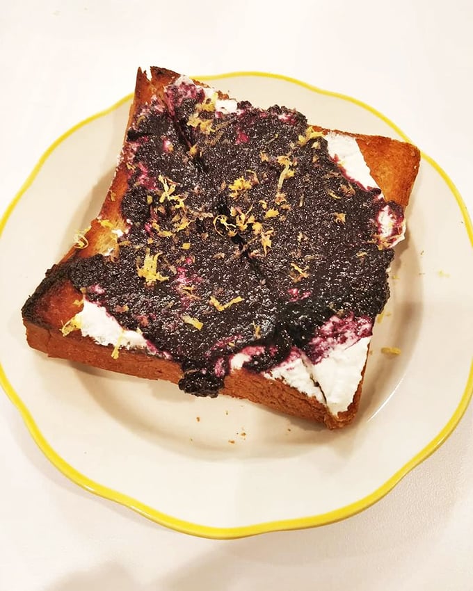 Toast elevated to art form—thick-cut bread becomes the canvas for a vibrant jam creation that transforms breakfast into a celebration.