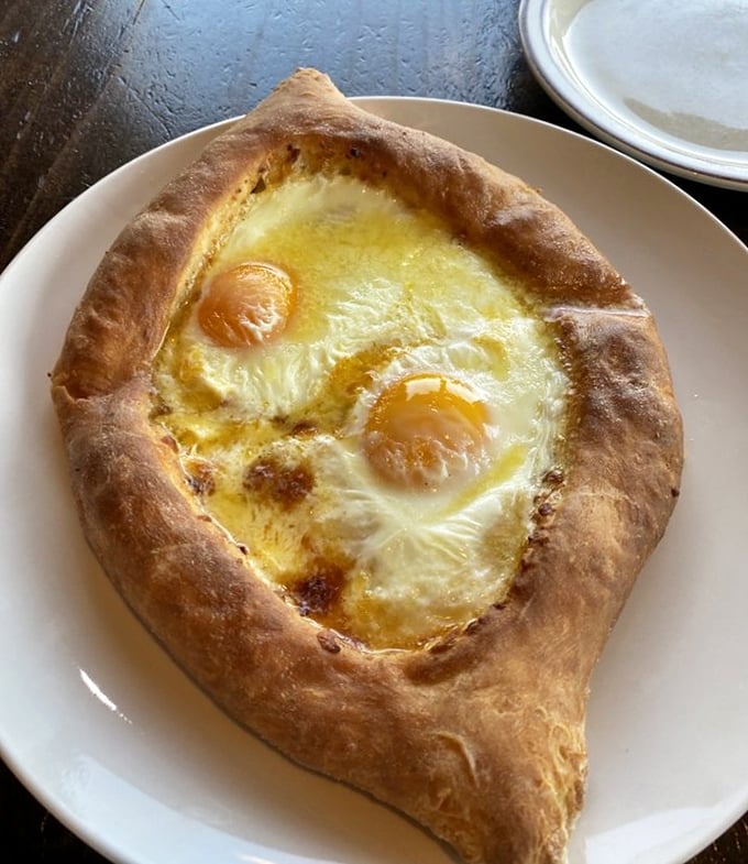 The Adjaruli khachapuri—a boat-shaped bread filled with cheese and topped with eggs that's worth the drive to Loganton alone.