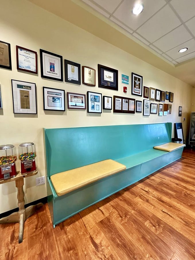 The wall of accolades and comfy waiting bench—where anticipation builds and strangers bond over shared pancake dreams.