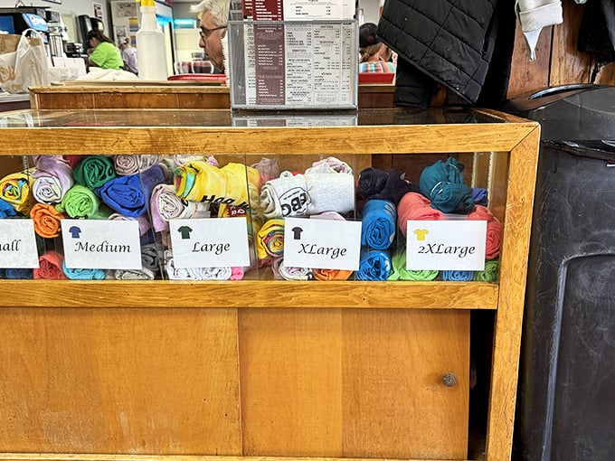The merch display – because sometimes you need a souvenir t-shirt to prove you made the pilgrimage to one of North Carolina's barbecue holy lands.
