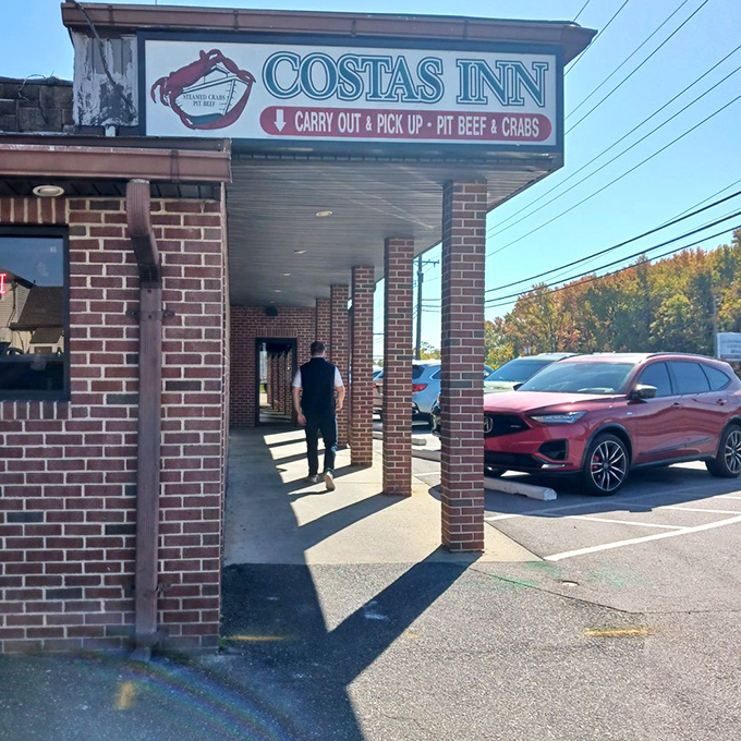 The entrance beckons with promises of "Carry Out & Pick Up" – because sometimes you want to enjoy those famous crabs at home.