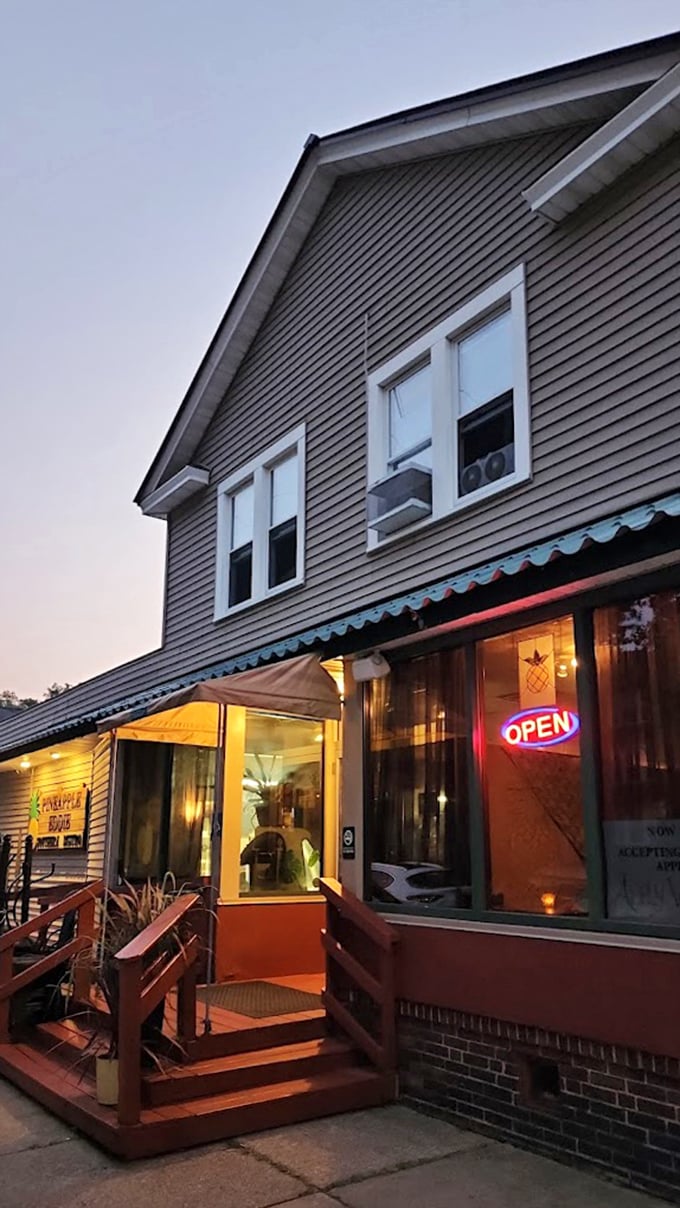 As dusk falls, the warm glow from Pineapple Eddie's windows feels like an invitation to the best dinner party in town. RSVP immediately.