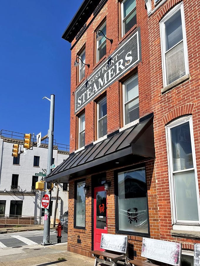 The classic brick façade against blue sky—a Baltimore landmark that's been satisfying seafood cravings for generations.