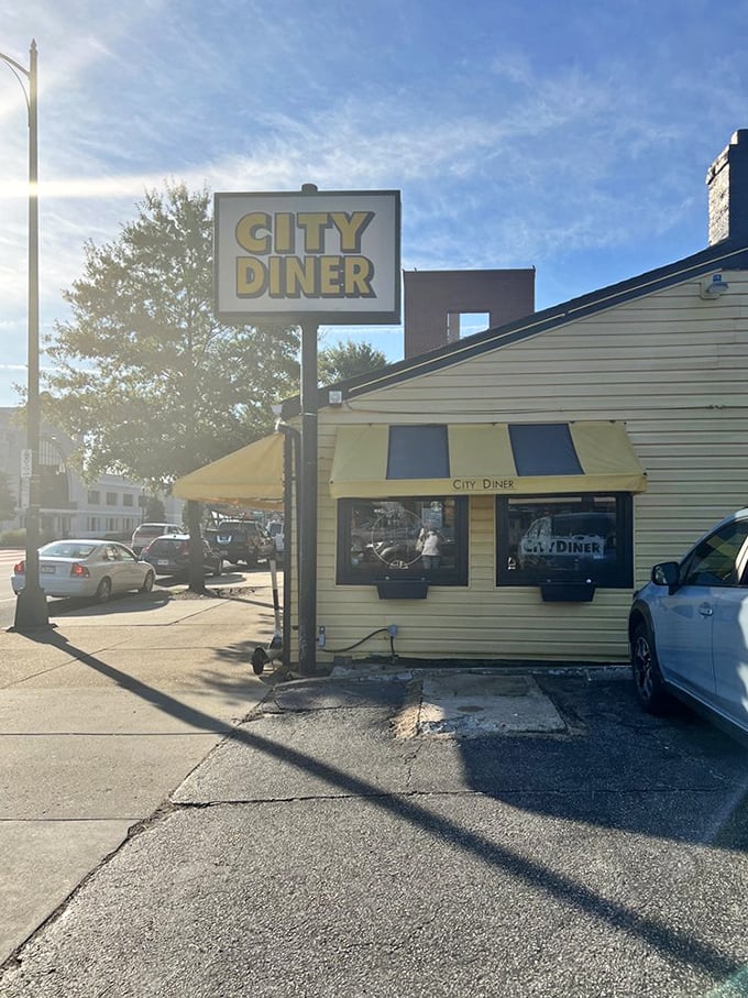 Morning sunshine hitting the City Diner sign—nature's way of pointing hungry travelers toward breakfast salvation.
