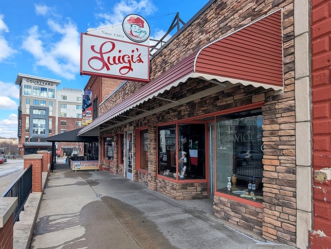 Luigi's exterior view shows how it stands proudly amid modern development—a delicious time capsule holding its ground in downtown Akron.