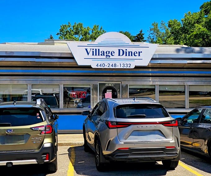 Summer sunshine makes the Village Diner's iconic blue trim pop against the white exterior—like a beacon of breakfast hope on even the cloudiest Ohio morning.