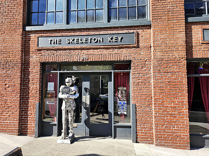 The entrance guardian—a life-sized statue seemingly made of bones—stands eternal watch at the doorway, silently judging whether you're curious enough to deserve entry into this realm of oddities.