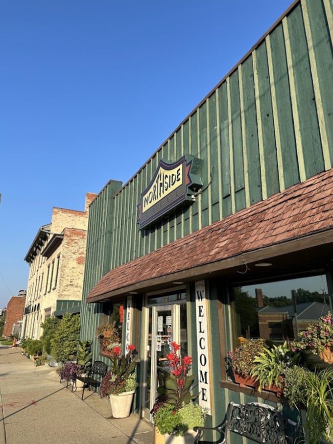 Even from the outside, you can tell this place has stories to tell—the welcome sign and potted plants practically whispering "come in, we've been expecting you."