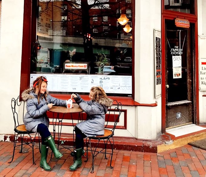 Winter sidewalk seating proves that true love for ice cream knows no seasonal boundaries or temperature limits.