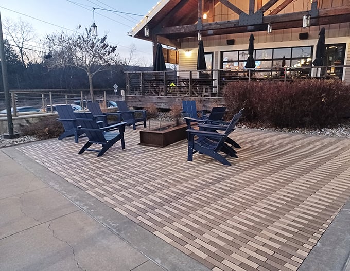 The outdoor seating area transforms ordinary evenings into memorable gatherings around the fire pit – Missouri nights at their finest.