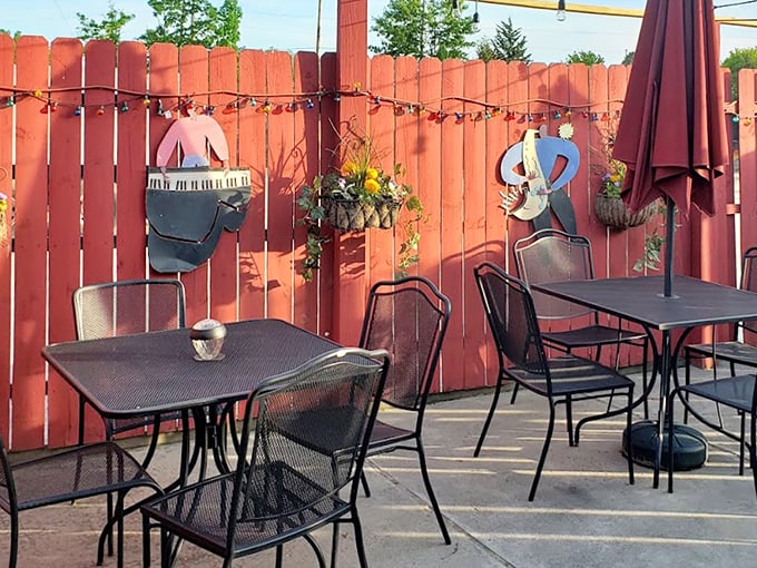 The outdoor patio, where musical silhouettes watch over your meal, offers fresh air that somehow improves the already-perfect barbecue experience.
