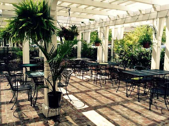 The outdoor patio dappled with California sunshine offers al fresco dining under white pergolas. Hanging ferns sway gently as if nodding approval at your excellent restaurant choice.