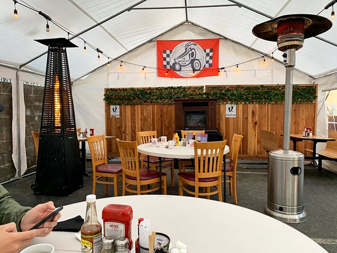 Outdoor dining with string lights and heaters. Pandemic-era innovation meets breakfast tradition in this cozy tent of culinary delights.