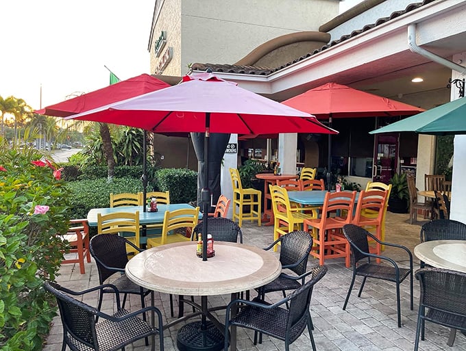 Florida dining as it should be—outdoors! These cheerful tables under bright umbrellas offer the perfect spot to savor breakfast while soaking up that famous Naples sunshine.