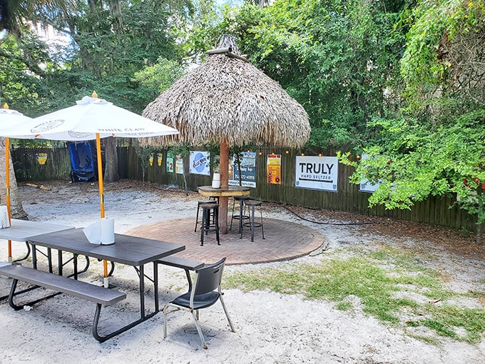 Tiki huts and picnic tables create an outdoor oasis where time slows down and seafood tastes even better.