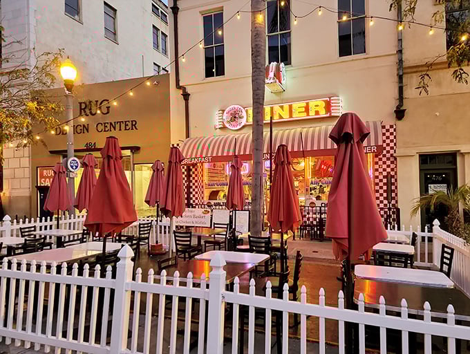 As day turns to evening, the outdoor seating glows with possibility—a front-row seat to Ventura's street theater with comfort food as your companion.