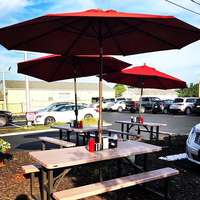 Outdoor seating with cheerful red umbrellas—because sometimes pancakes taste even better with a side of fresh air and Pennsylvania sky.
