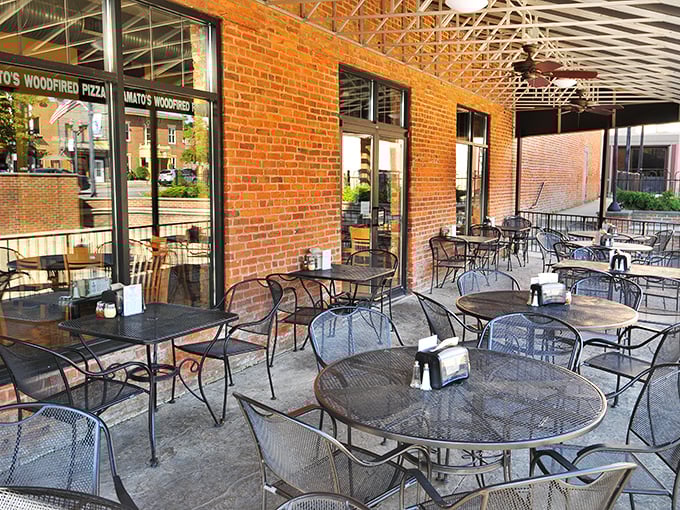 The outdoor patio at Amato's—where pizza enjoyment meets fresh air in a brick-walled urban oasis that begs you to linger just a little longer.