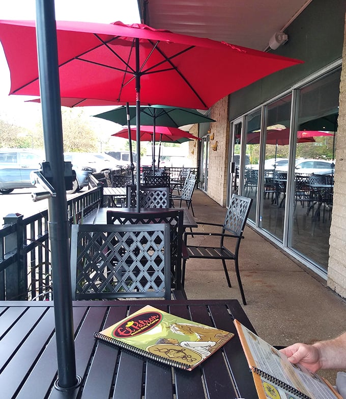 The outdoor seating area offers fresh air enthusiasts a chance to enjoy their burritos beneath cheerful umbrellas—Mexican vacation vibes included.