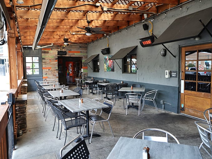 The outdoor patio at Wheat Penny—where string lights, wooden beams, and comfortable seating invite you to linger over one more glass of wine.