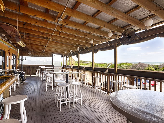 The oceanview deck – where salty breezes enhance every bite and remind you why Florida dining beats eating in a windowless chain restaurant.