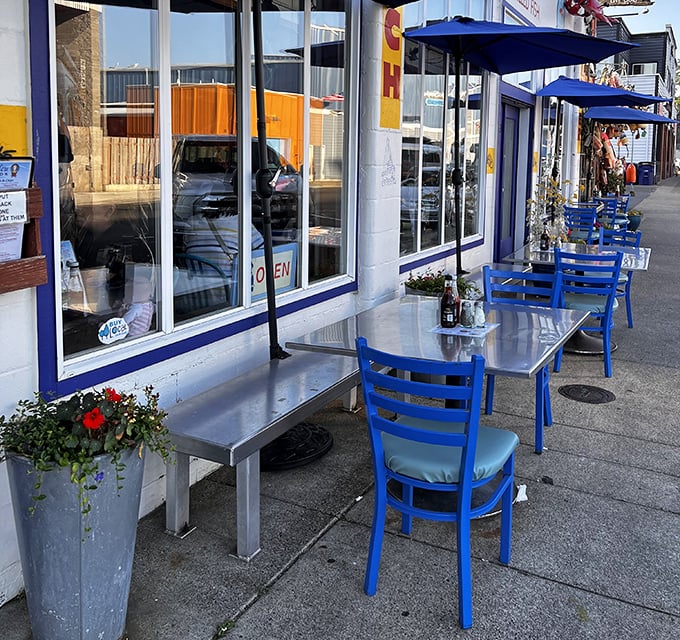 Sidewalk seating with signature blue chairs offers the perfect perch for people-watching with your seafood – because ocean views taste even better with a side of fresh air.