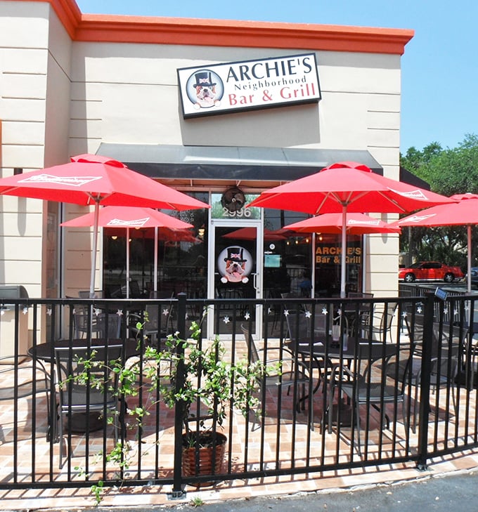 The outdoor patio offers al fresco dining under those signature red umbrellas – a proper British experience with Florida's sunshine as a bonus.