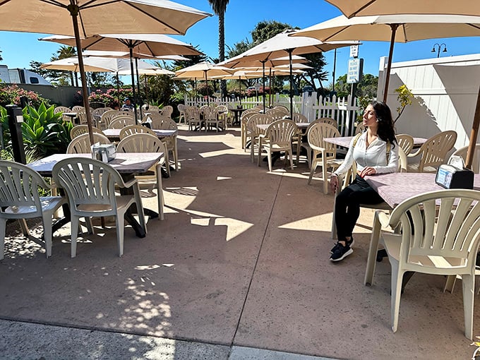 Outdoor seating where ocean breezes enhance every bite. The perfect California dining experience: sunshine, sea air, and seafood that just stopped swimming.