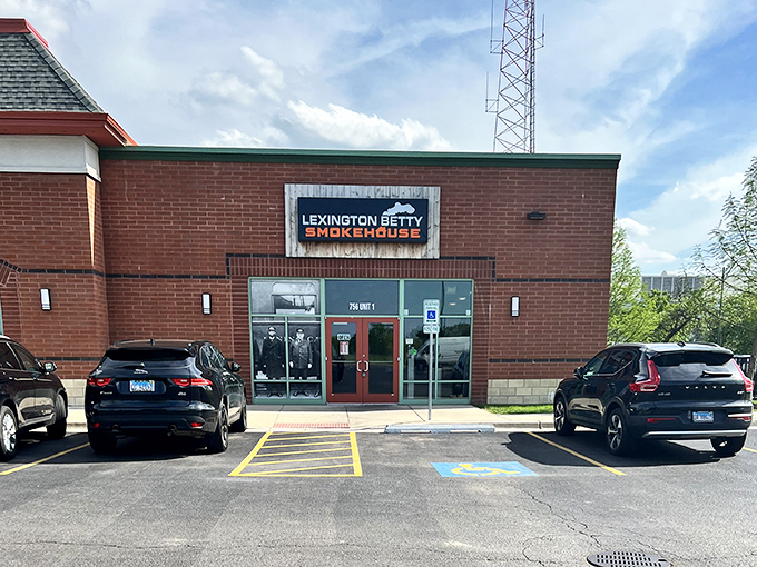 The parking lot view that promises satisfaction ahead—like spotting an oasis after miles of fast-food desert. Your barbecue journey ends (and begins) here.