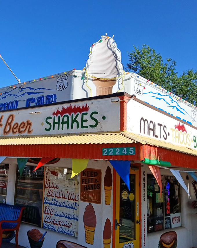 The Snow Cap's exterior promises three essential road trip food groups—shakes, malts, and tacos—under one gloriously kitschy roof.