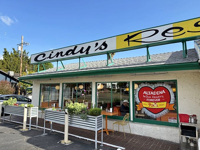 The exterior view reveals Cindy's local heart with its "Altadena In Our Hearts Forever" sign—a neighborhood treasure serving up memories.