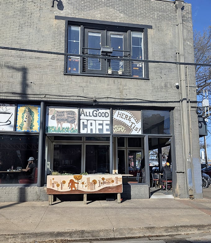 The exterior view showcases the cafe's artistic soul with hand-painted signs that promise good food and good vibes in equal measure.