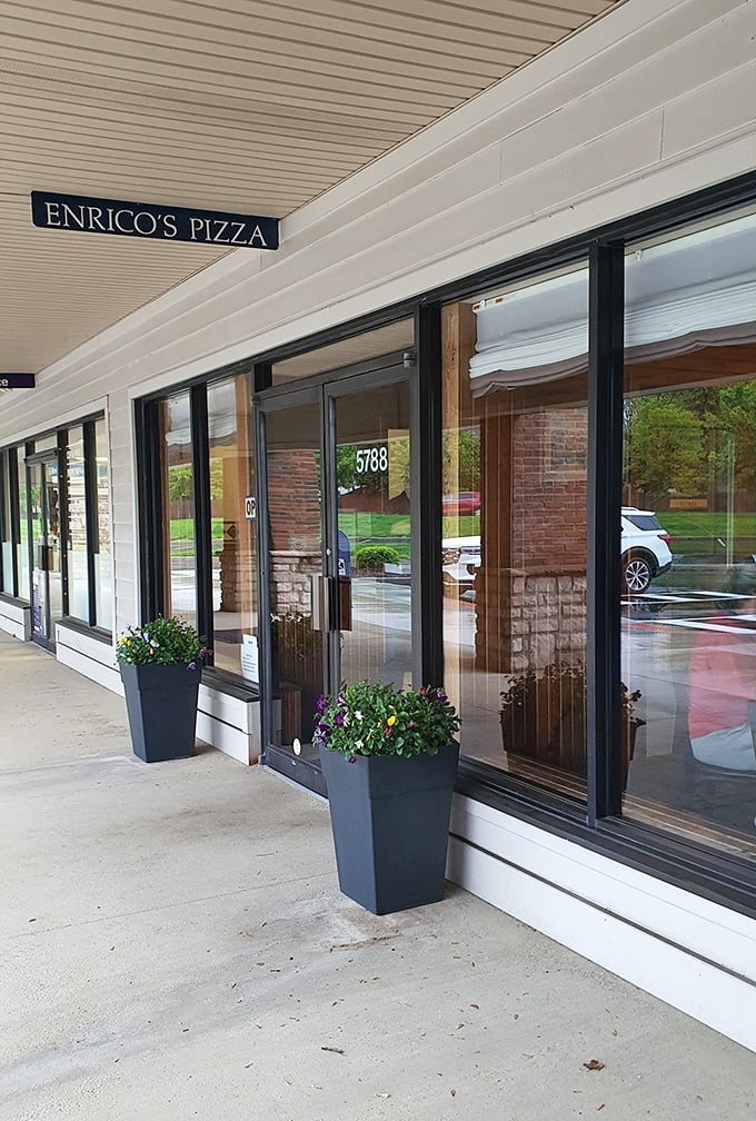 Those planters flanking the entrance aren't just decorative—they're the first hint that someone inside cares about details. Good food always begins with caring.