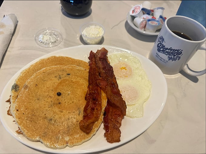 The blueberry pancake breakfast – where those famous berries infiltrate another breakfast classic, proving lightning can indeed strike twice in the same kitchen.