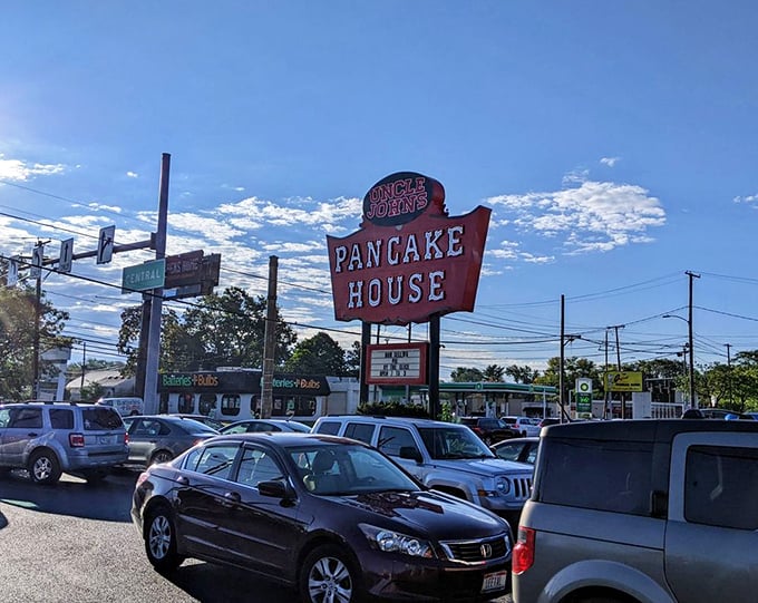 The iconic Uncle John's sign stands tall against the Toledo sky, a retro beacon guiding breakfast pilgrims to their fluffy, syrup-soaked destination.