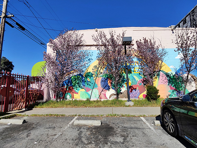 Spring blossoms complement the colorful mural behind the store – a hidden pocket of beauty in the urban landscape of San Francisco.
