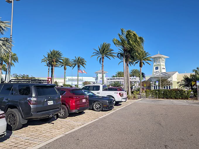 Ample parking surrounded by palm trees—the first hint that this isn't your average, utilitarian outlet shopping experience.