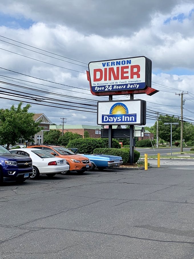 The roadside sign proudly announces "Open 24 Hours Daily"—because breakfast cravings don't follow conventional schedules, and neither should diners.