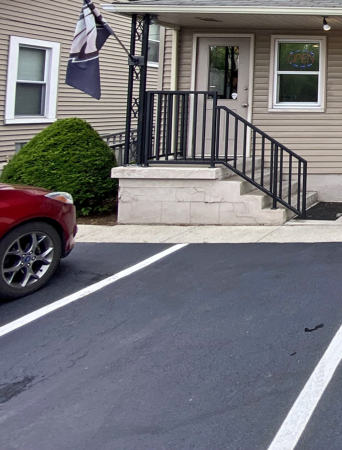 The modest entrance and parking area – your first clue that this place prioritizes substance over style.