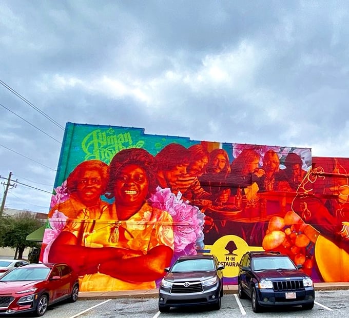 The parking lot view of that magnificent mural reminds you: this isn't just a meal stop—it's a pilgrimage destination for food lovers.
