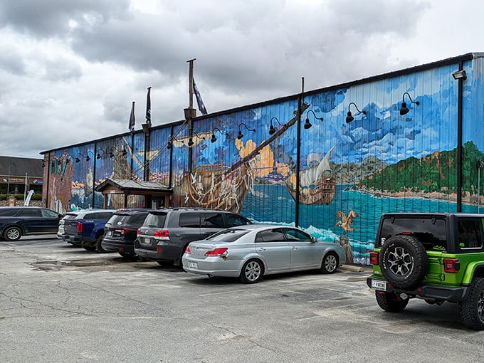 Even the parking lot tells a story with its vibrant seaside mural—a surprising splash of color that hints at the creativity waiting inside.