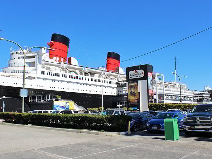 From the parking lot, the Queen Mary's imposing silhouette promises an adventure that bridges the gap between this world and whatever might lie beyond.