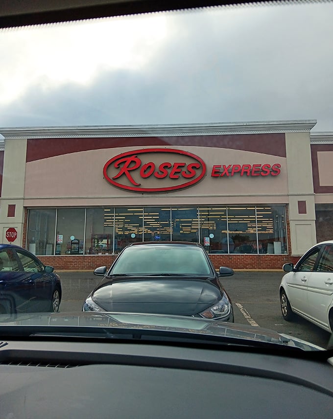 The red sign glows like a beacon of bargains against cloudy skies—a siren call to Delaware shoppers seeking retail therapy without financial regret.