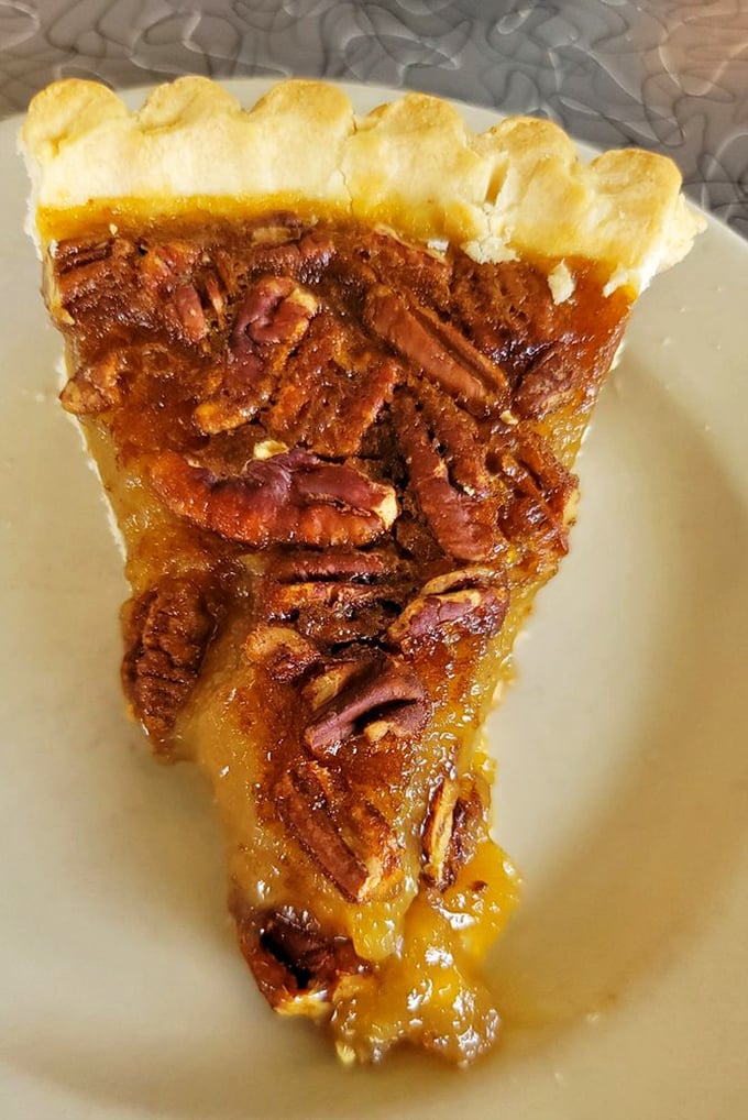 Pecan pie that makes you wonder why anyone bothers with birthday cake – sweet, gooey, nutty perfection on a plate.